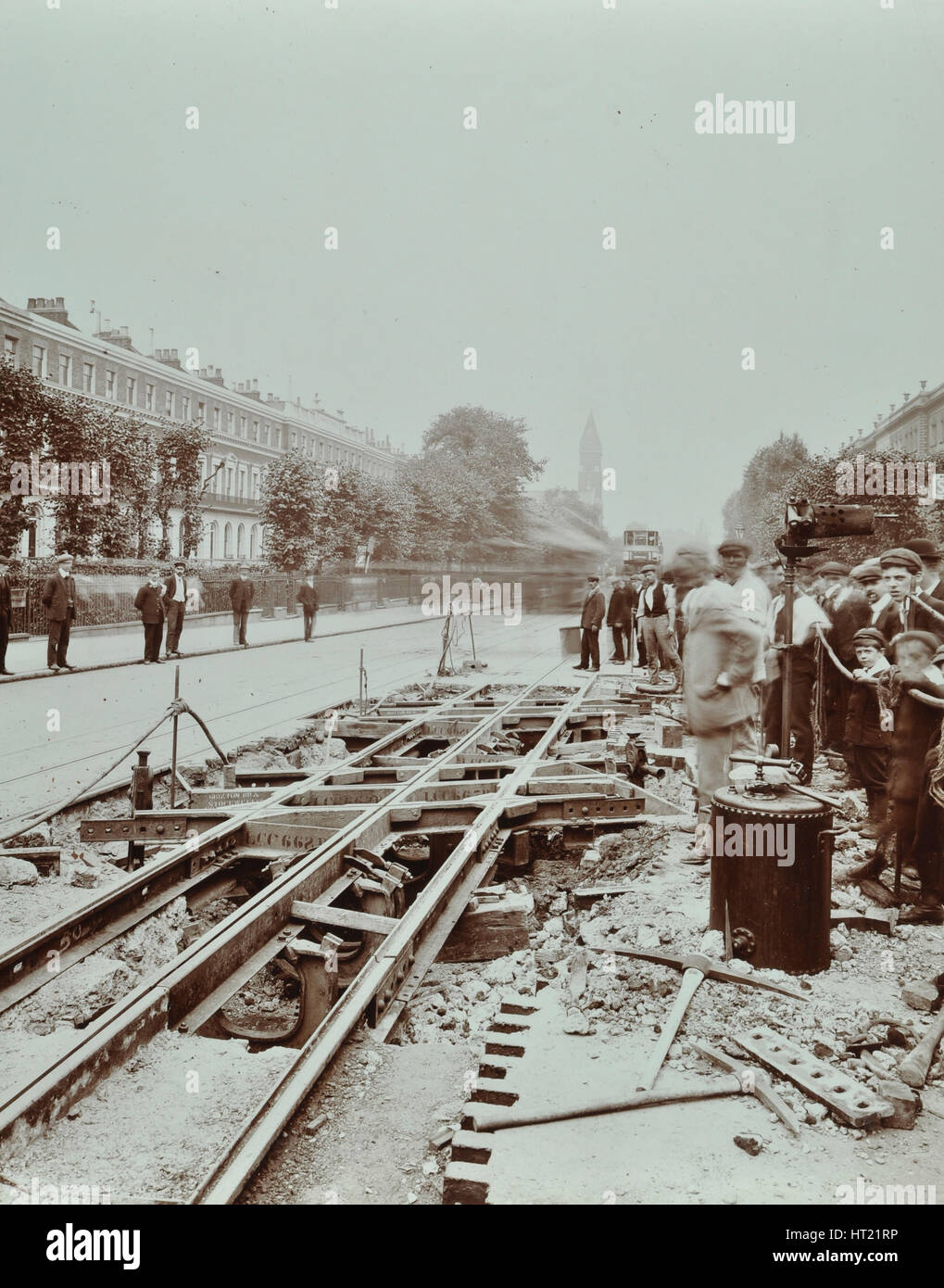 Workmen extending tramlines, Brixton Road, London, 1907. Artist ...