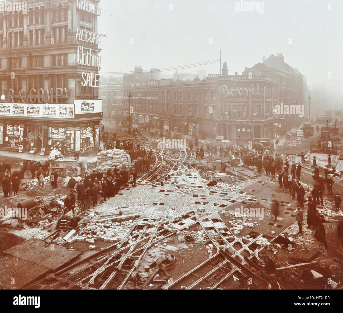 Laying tramlines at the junction of Whitechapel High Street and ...