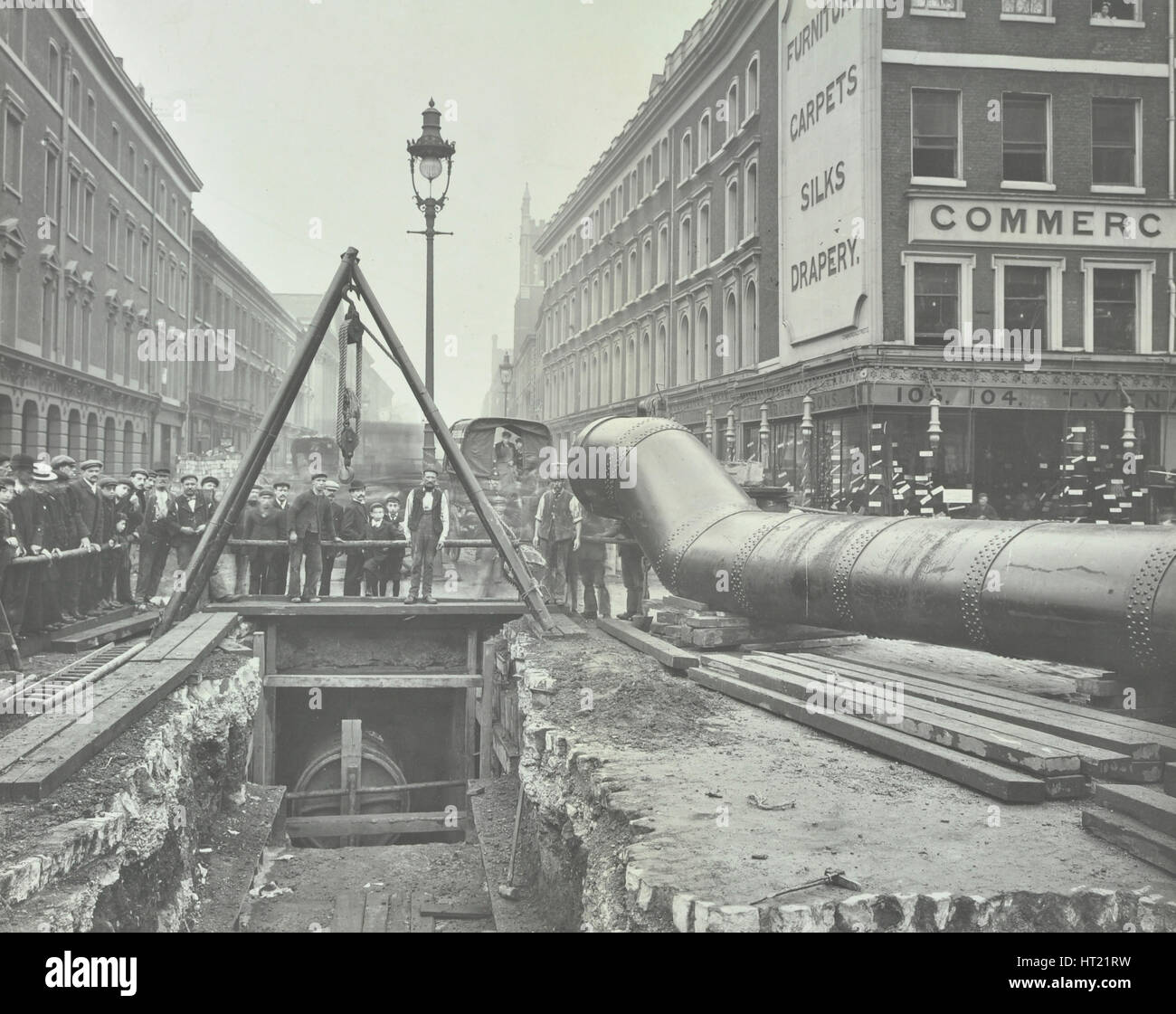Replacing an old gas main, Commercial Street, London, 1906. Artist ...
