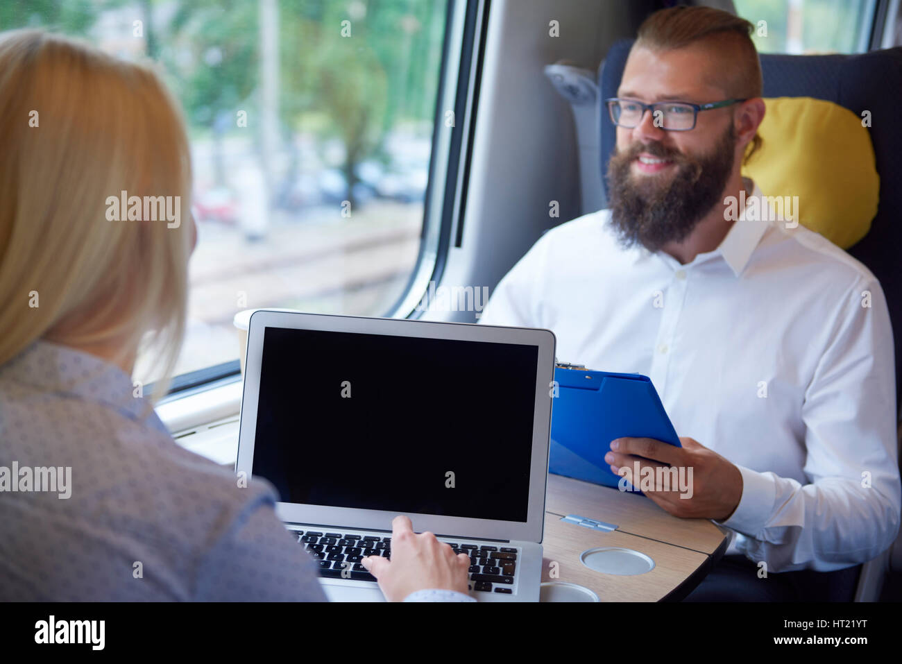 Screen of computer on the table indoor the train Stock Photo - Alamy