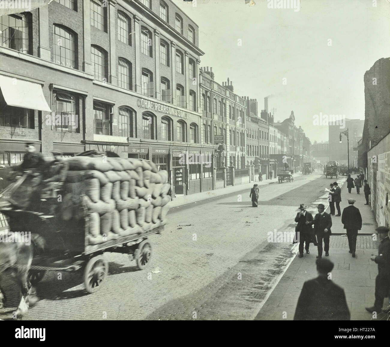 Cart laden with sacks, Mansell Street, Stepney, London, 1914. Artist ...