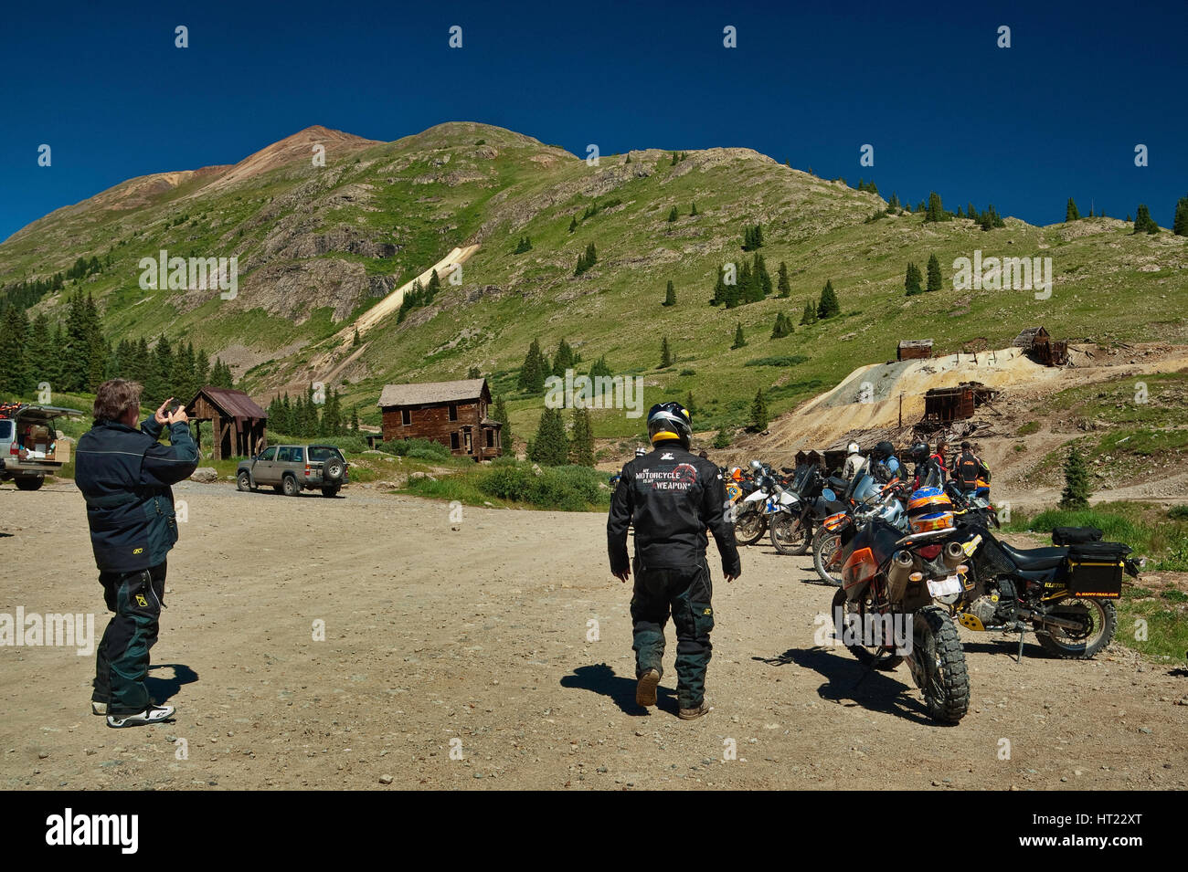 Group of bikers in Animas Forks ghost town, San Juan Mountains ...