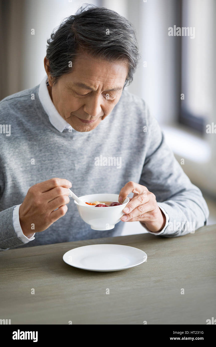 Adult eating porridge hi-res stock photography and images - Alamy