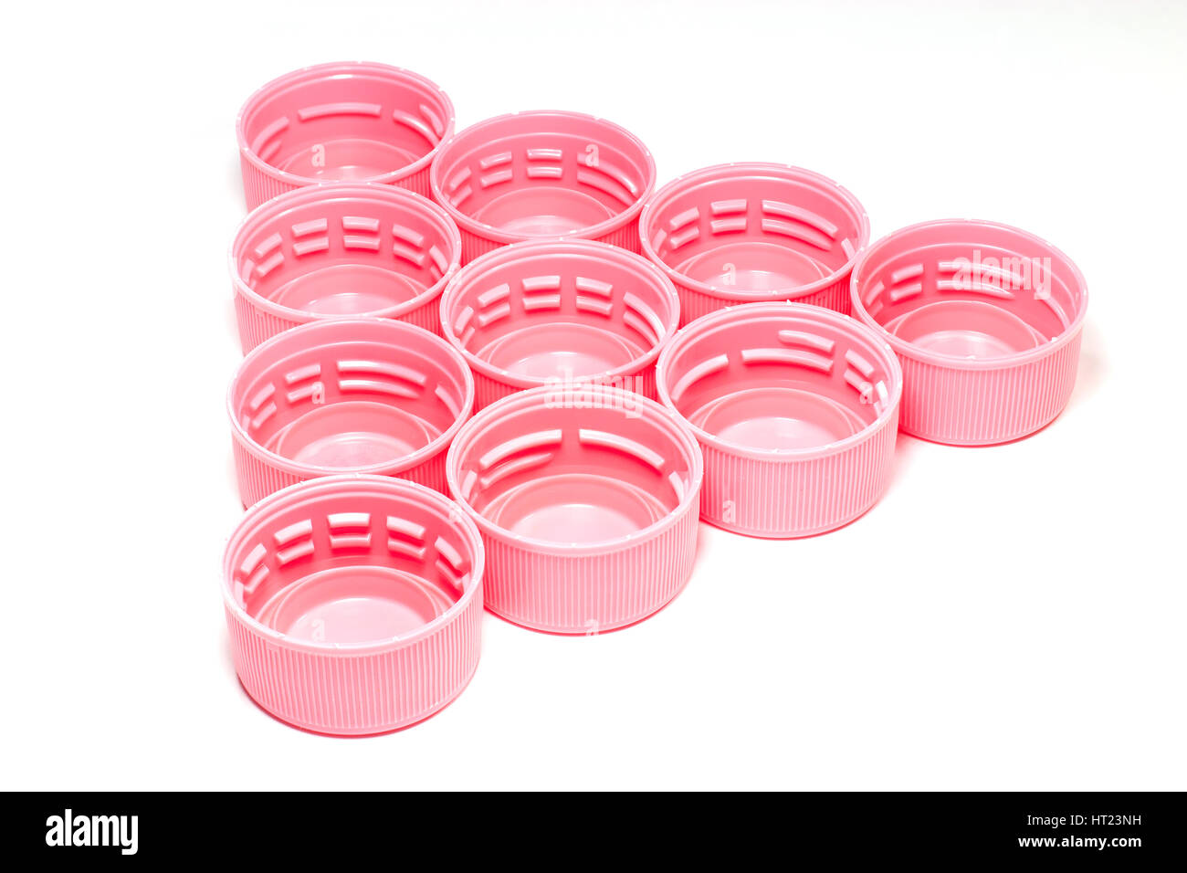 Pink bottle caps isolated on white background Stock Photo - Alamy