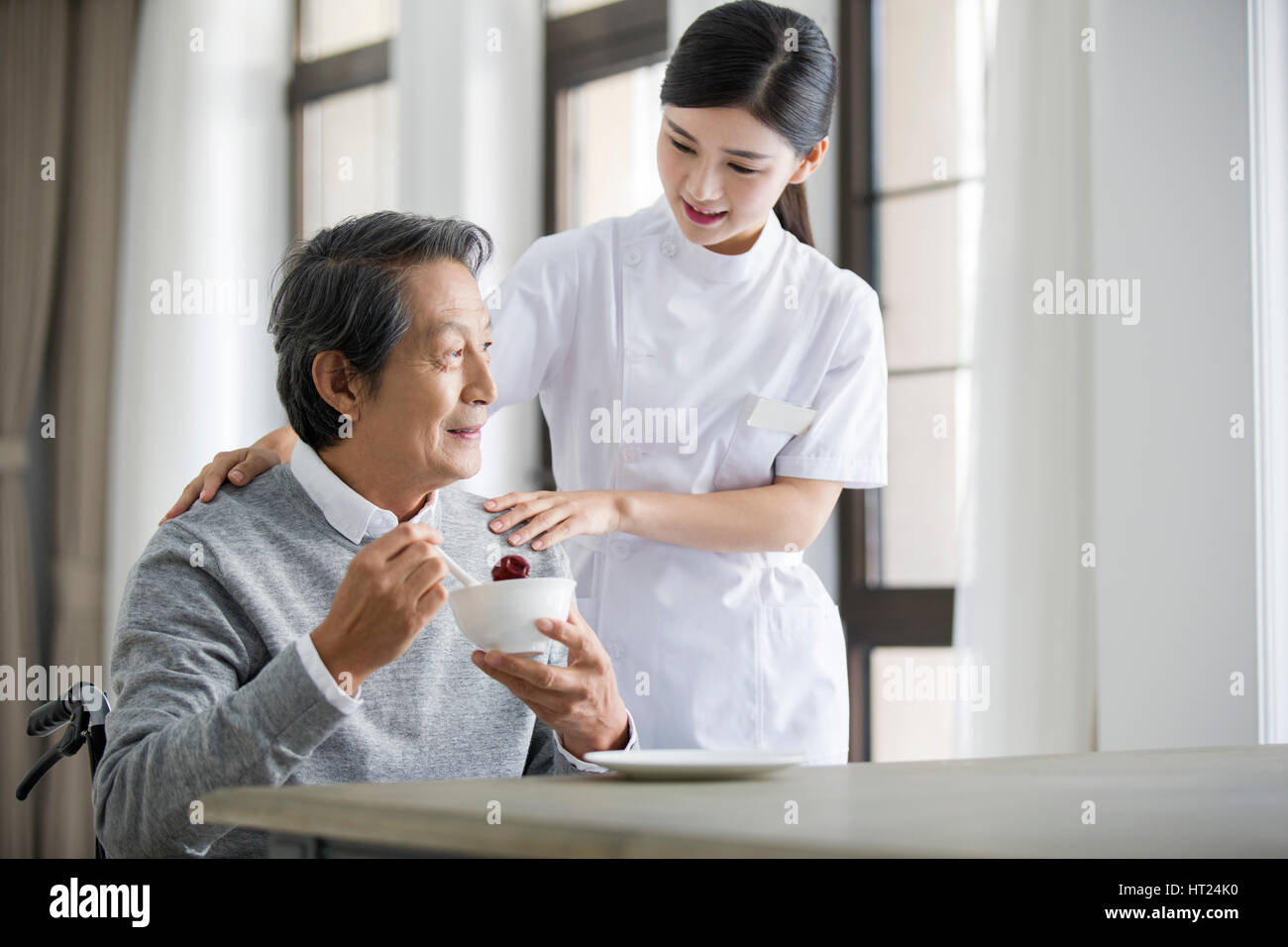 Medical assistant taking care disabled hi-res stock photography and ...