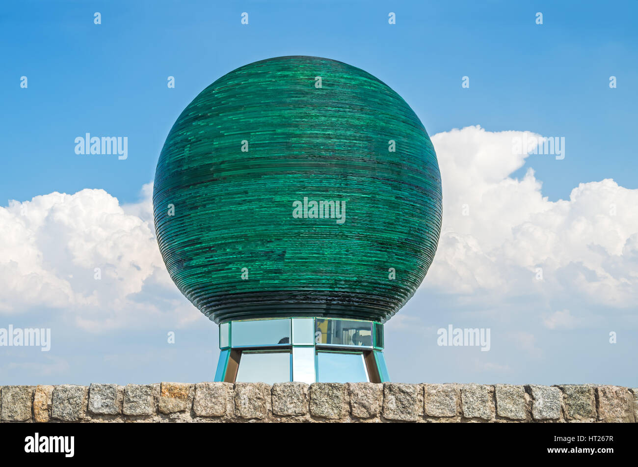 Large glass sphere on a mirrored pedestal and stone base Stock Photo ...