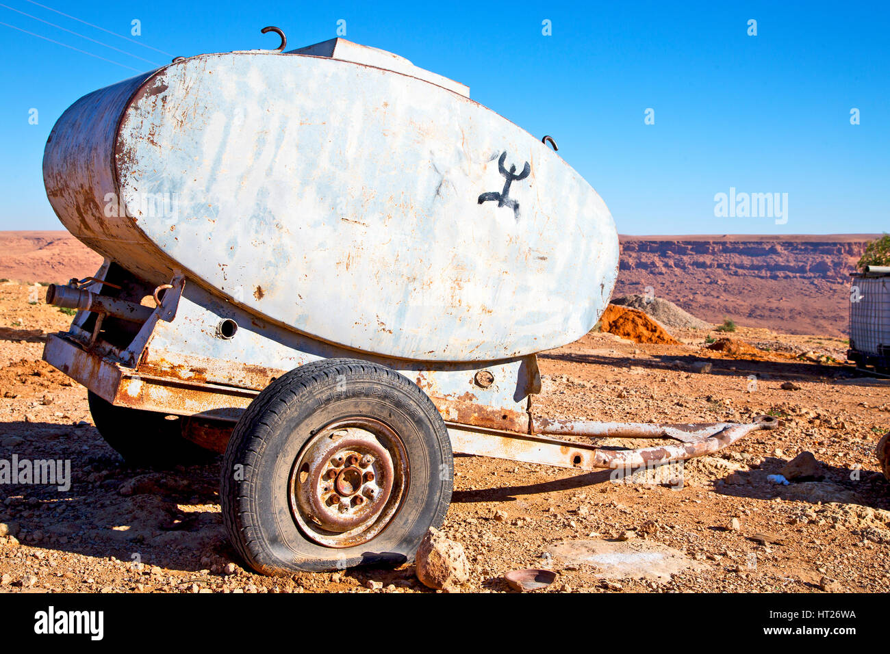 water tank in morocco africa land gray metal weel and arid Stock Photo ...