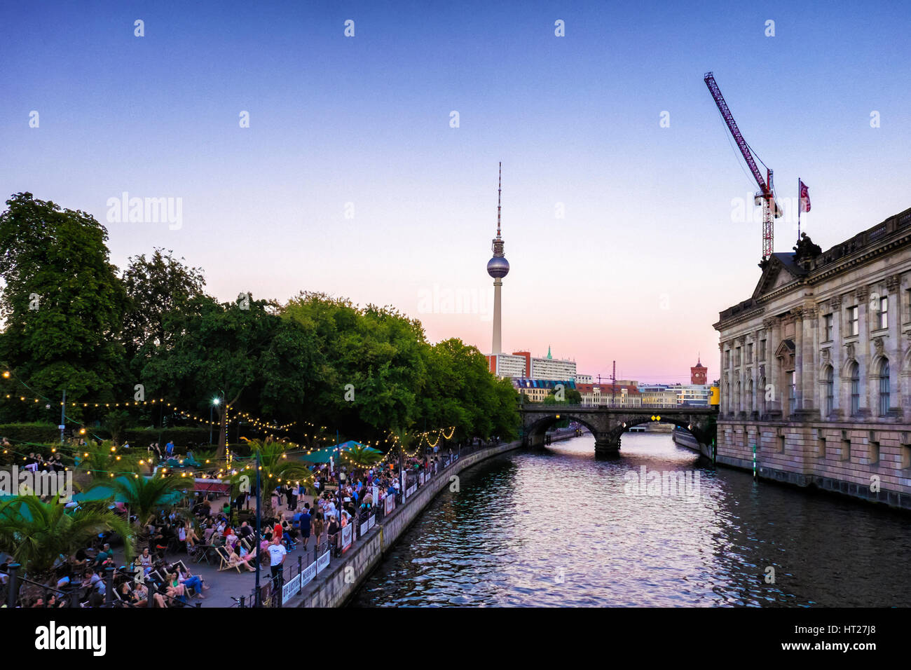 Berlin, Mitte. Beach bar and riverside dancing venue.Berliners enjoy a ...