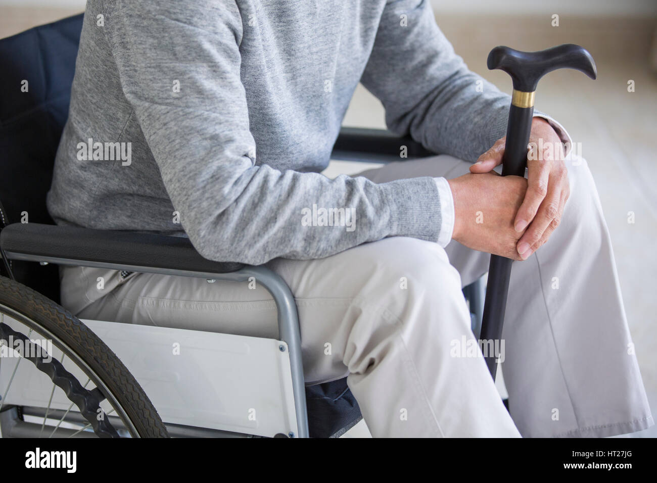 Wheelchair and a cane hi-res stock photography and images - Alamy