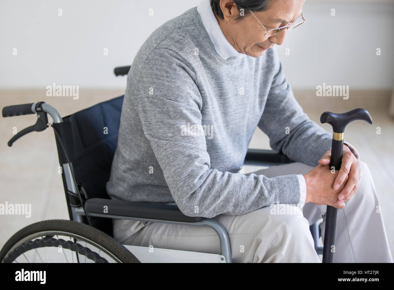 Wheelchair and a cane hi-res stock photography and images - Alamy