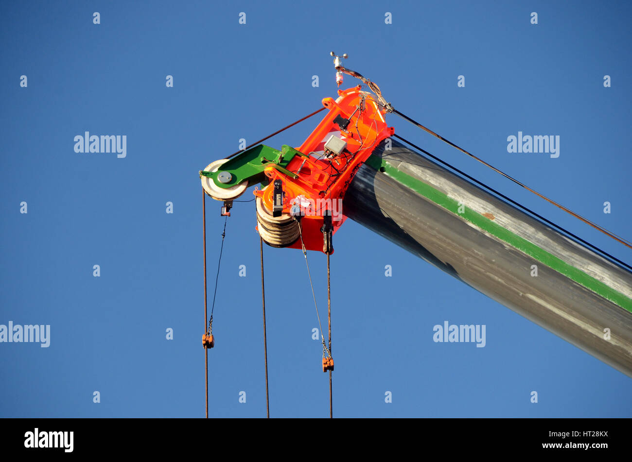 Detail of a large red and green mobile crane Stock Photo - Alamy