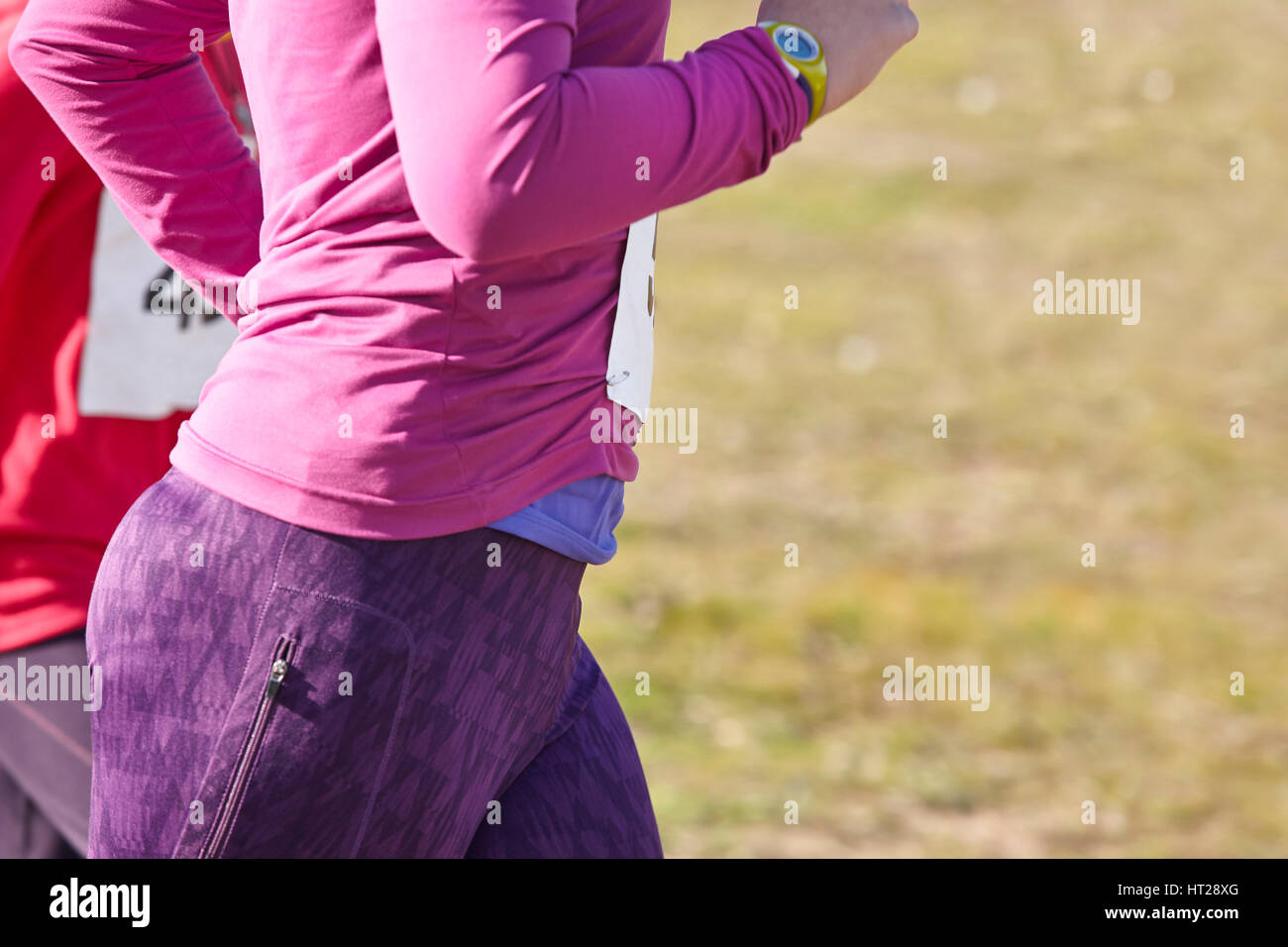 Female athletic runners on a cross country race. Outdoor circuit ...