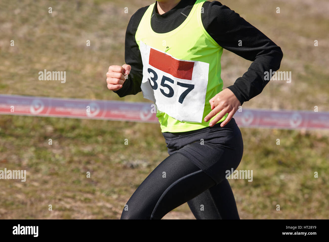 Male athletic runner on a cross country race. Outdoor circuit ...