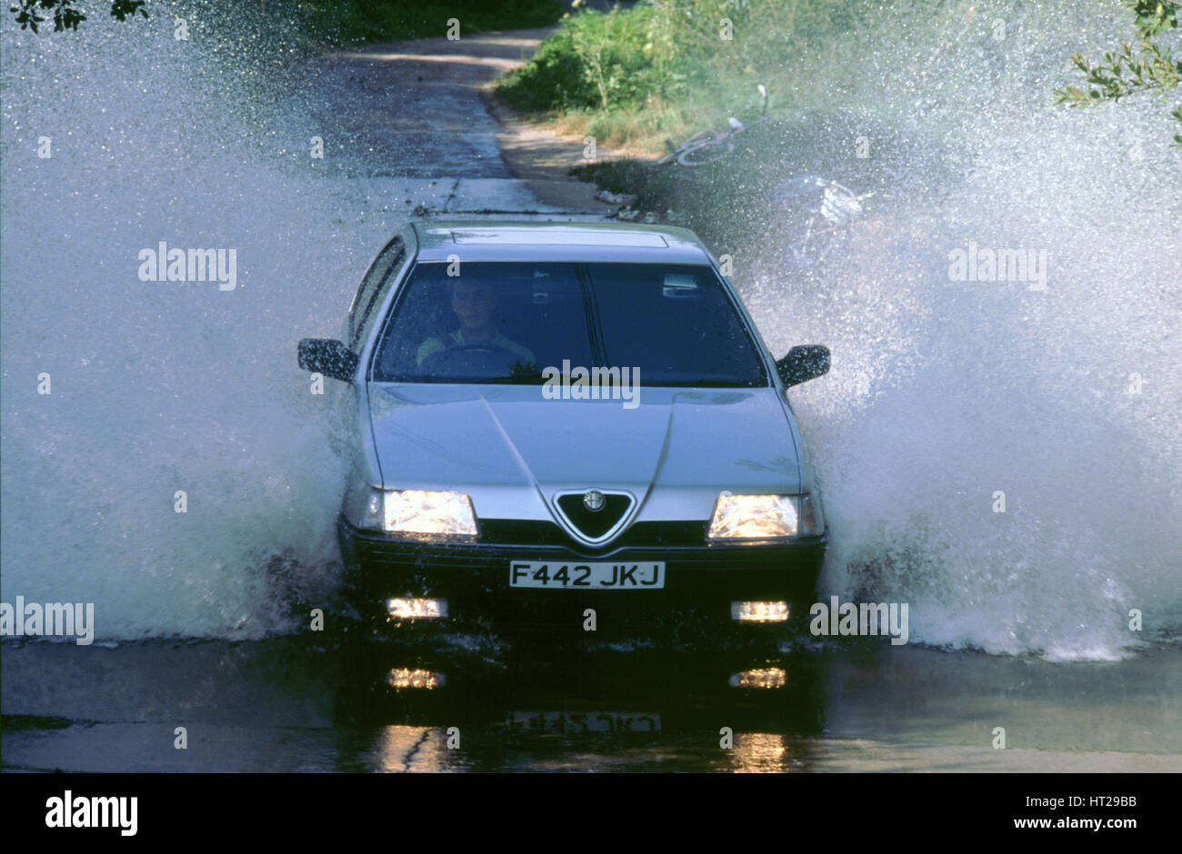 Vintage cars driving through hi-res stock photography and images - Alamy