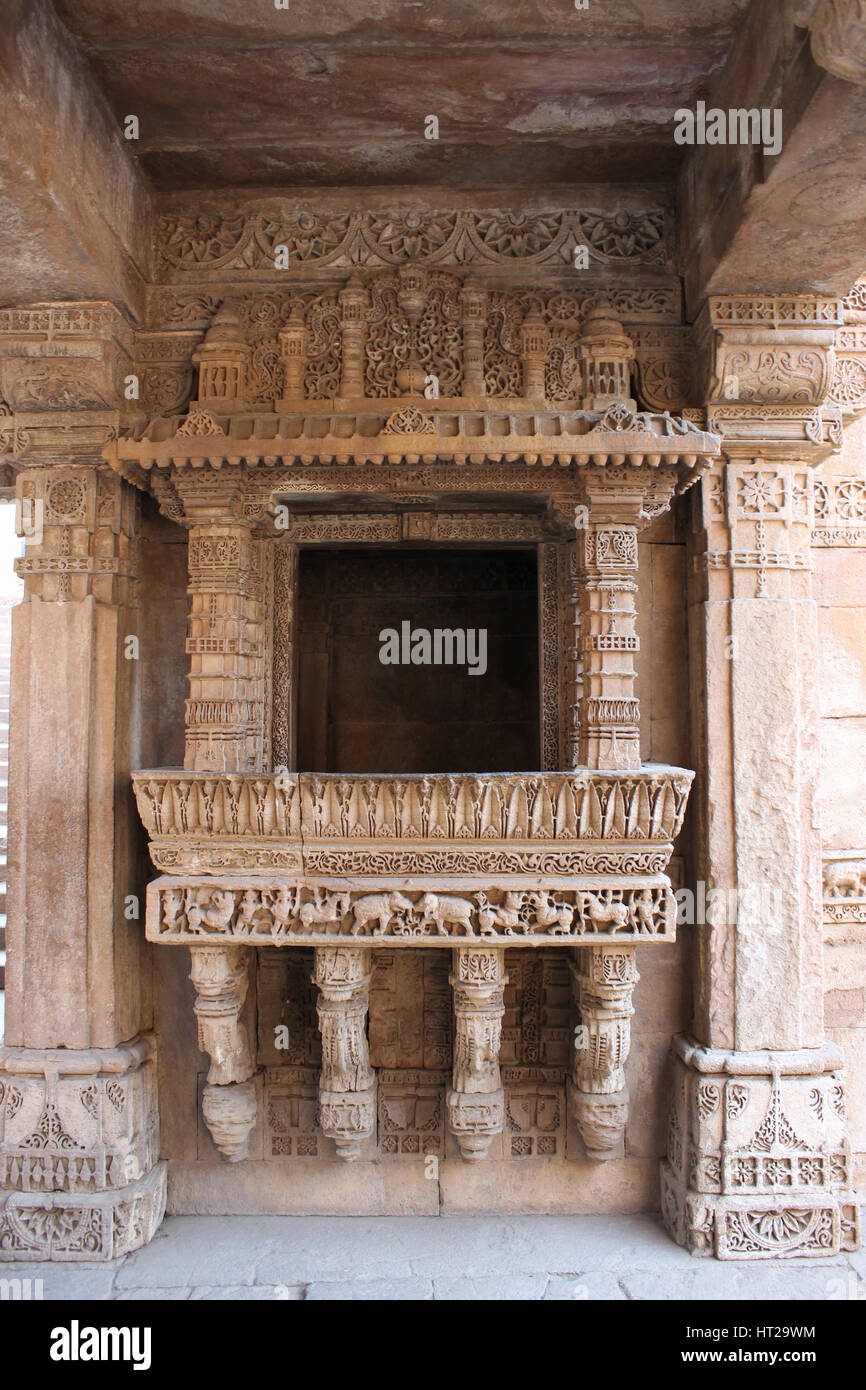 Intricate carvings and beautiful border patterns engraved on a balcony ...