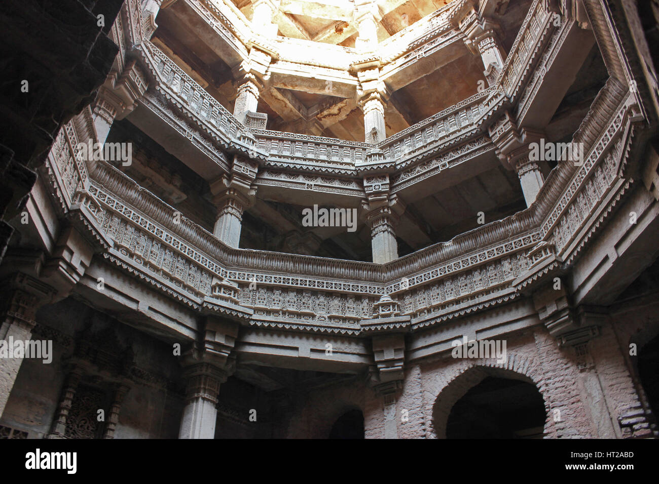 Upper storeys with intricate stone carvings on pillars, pilaster and ...