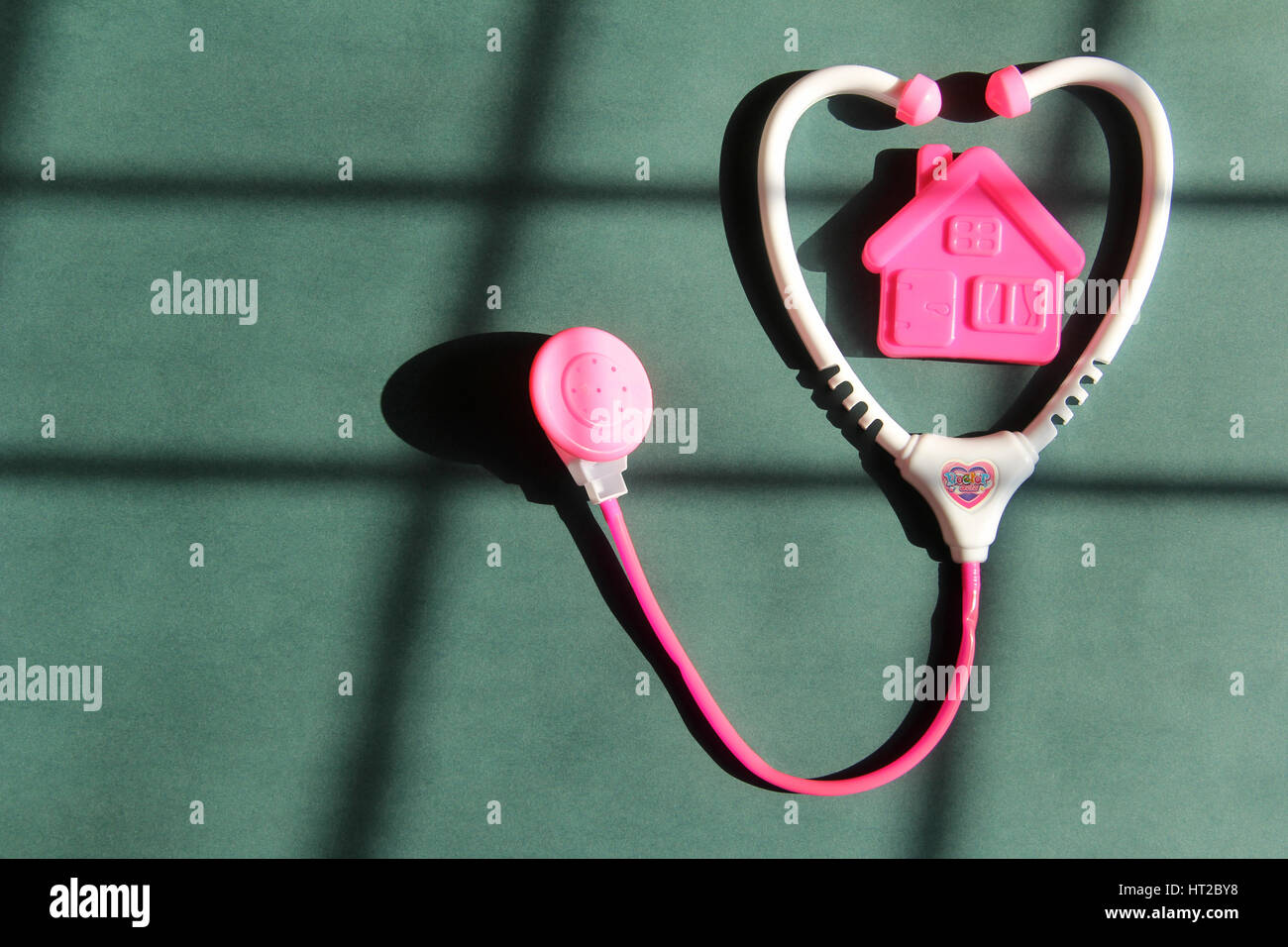 A pink house with pink or toy stethoscope Stock Photo - Alamy