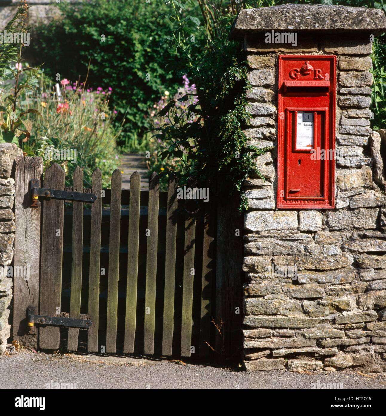 Wall-mounted post box and wooden gate, Upper Slaughter, Cotswolds ...
