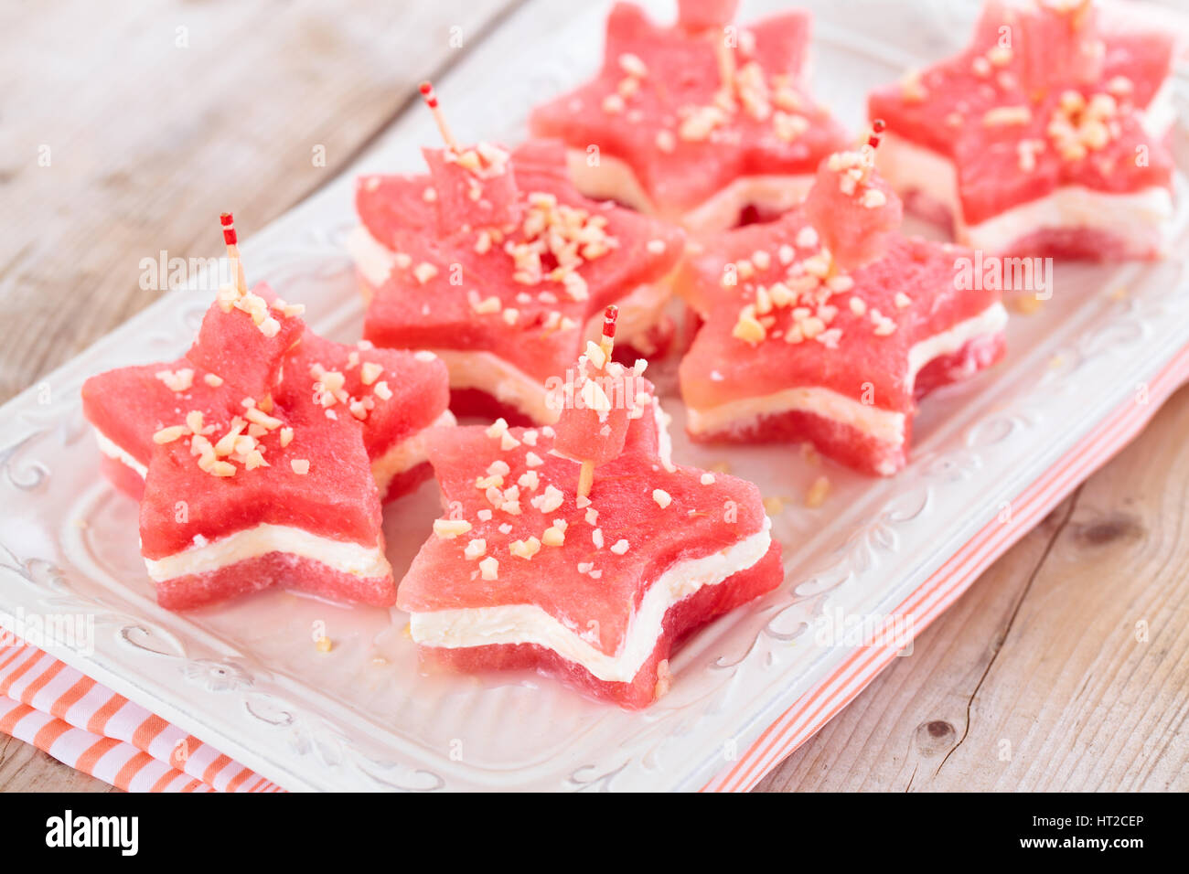 Star shaped watermelon sandwiches with soft cheese and nuts Stock Photo ...