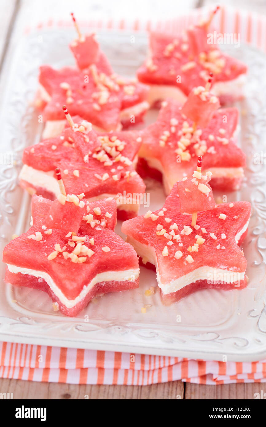 Star shaped watermelon sandwiches with soft cheese and nuts Stock Photo ...