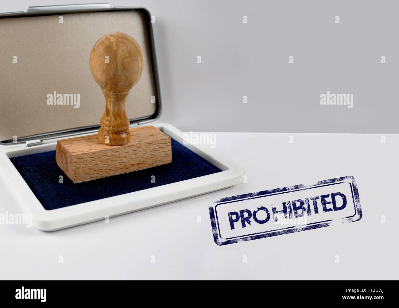 Wooden stamp on a desk PROHIBITED Stock Photo - Alamy