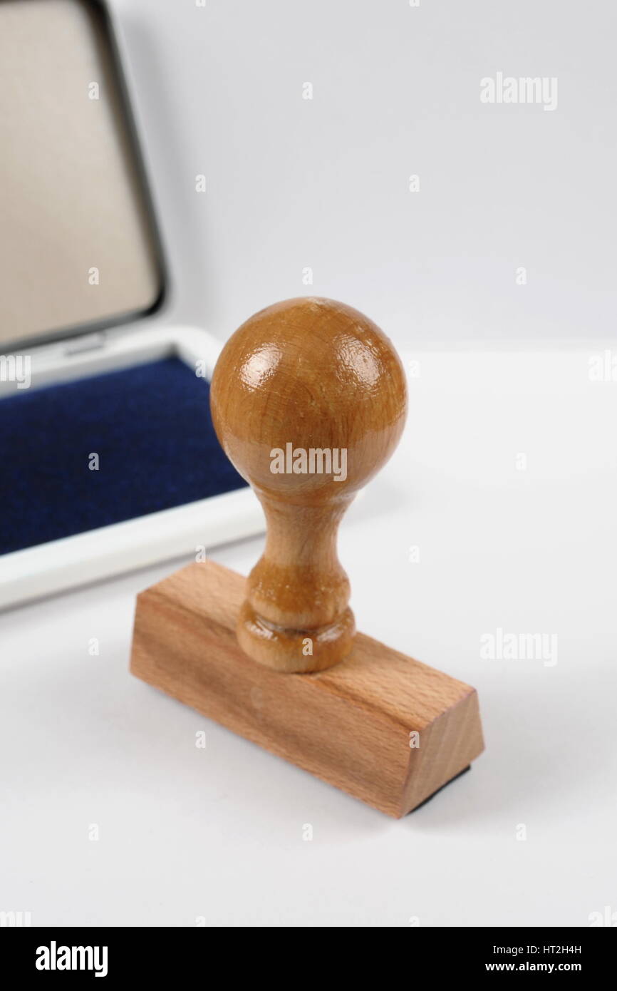 Wooden Rubber stamp and ink isolated on white background Stock Photo ...