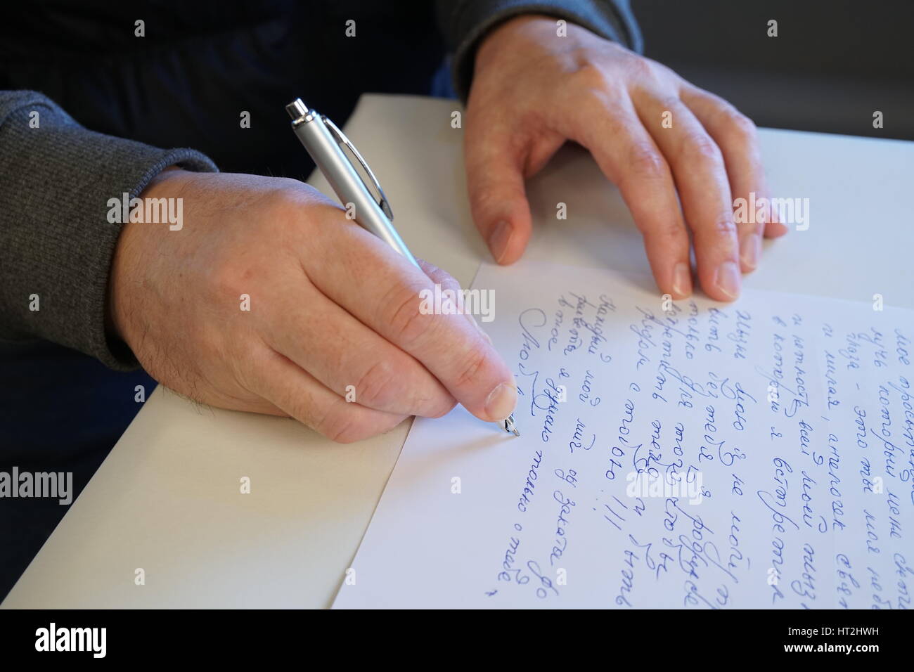 Man write letter at the desk Stock Photo - Alamy