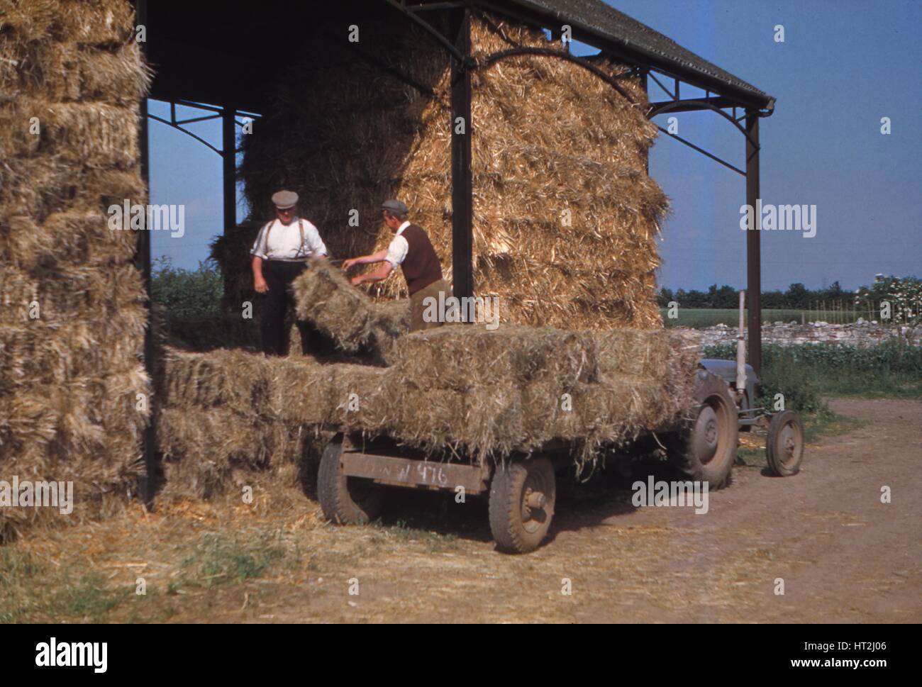 Stacking Bales of Hay in Dutch Barns, c1960s. Artist: CM Dixon Stock ...