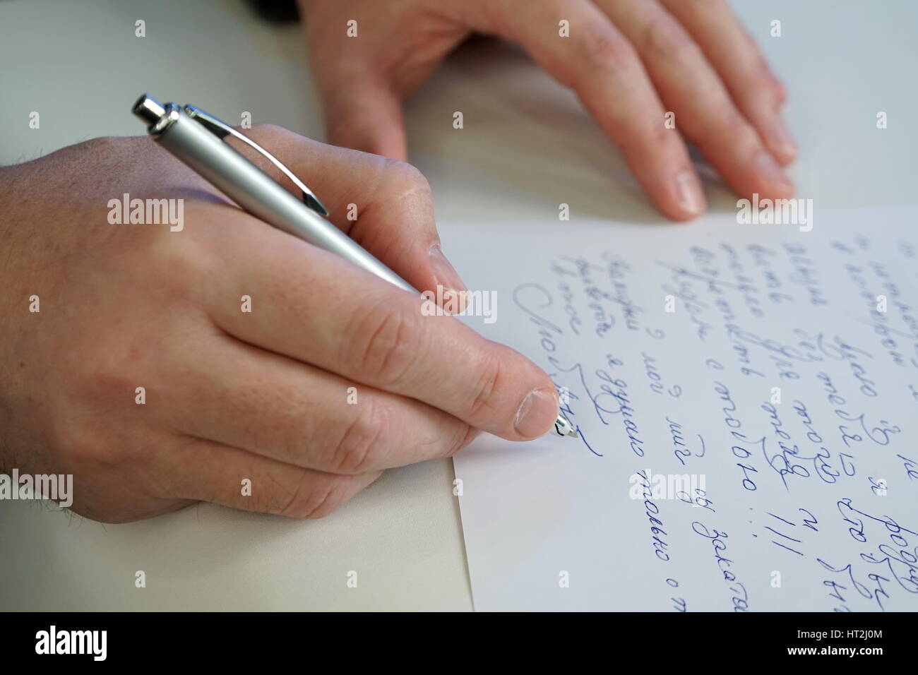 Man writing letter at the desk Stock Photo - Alamy