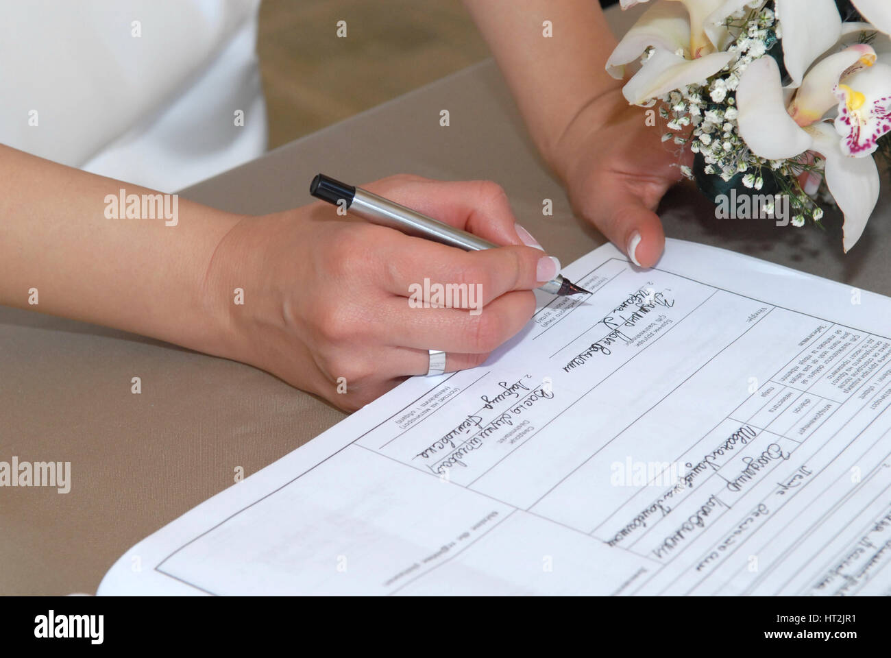 Woman signing marriage contract Stock Photo - Alamy