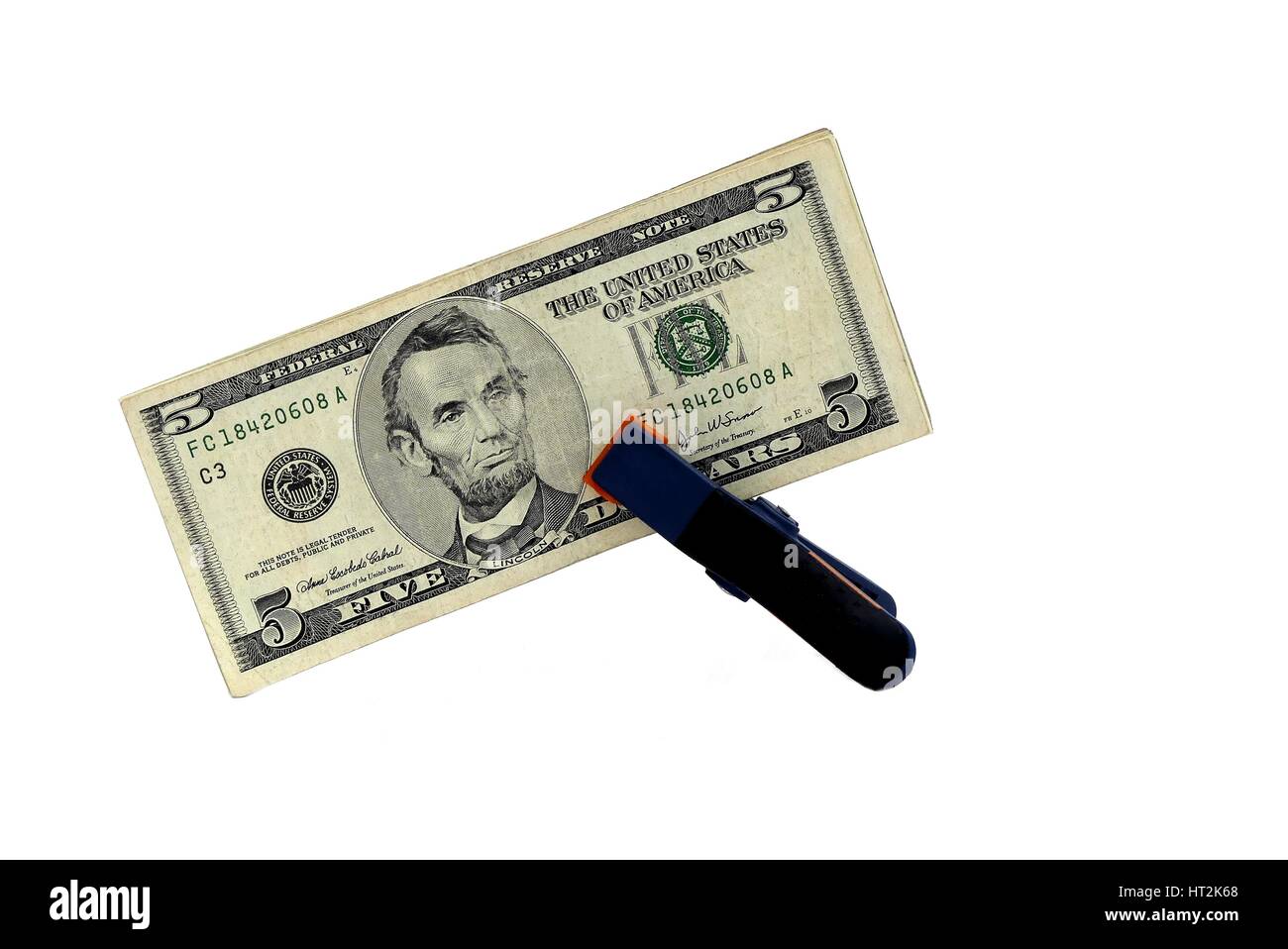 Closeup of a bundle of American dollar bank notes hold vertically by a ...