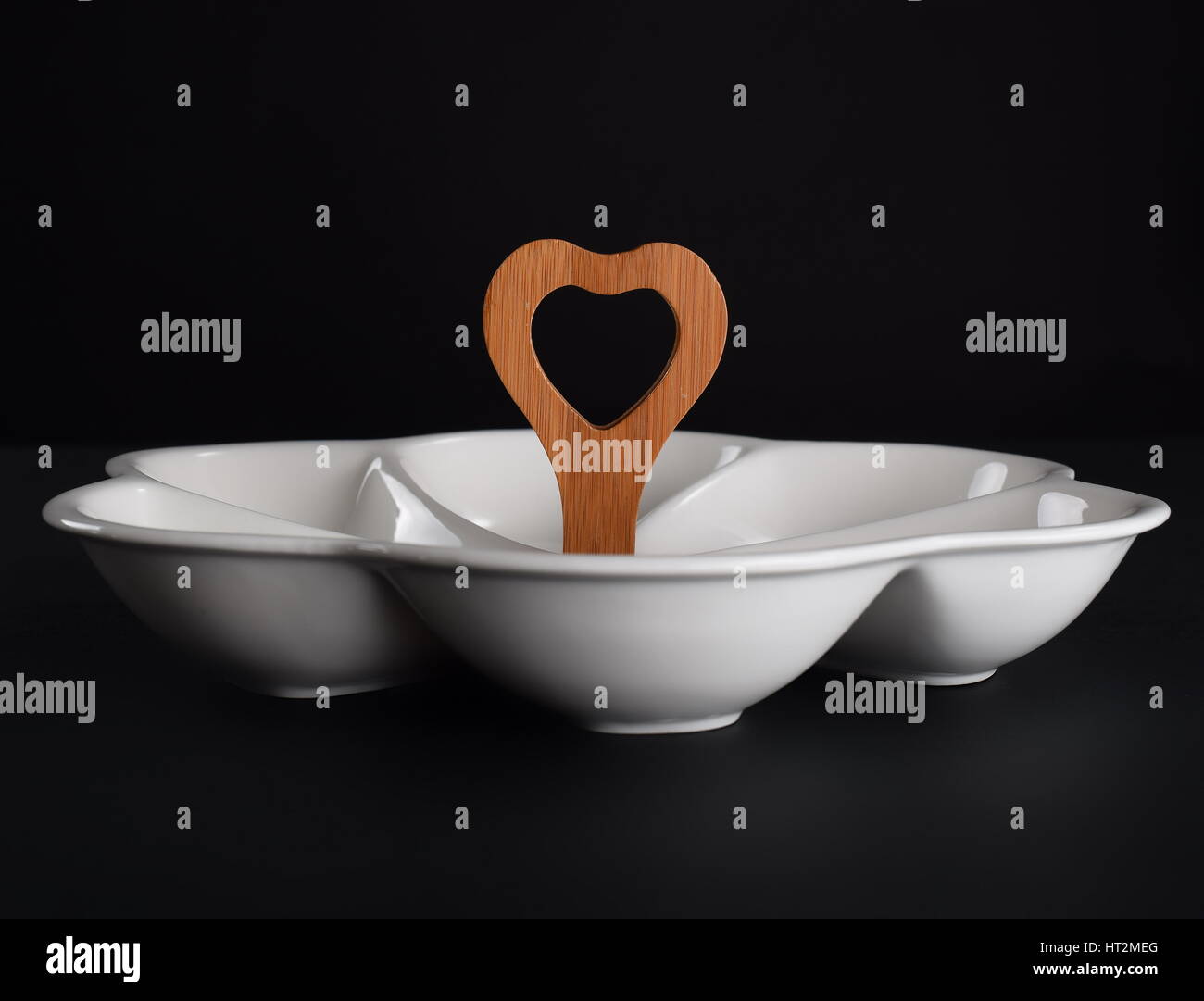 White shallow porcelain bowl with six compartments, front view Stock ...