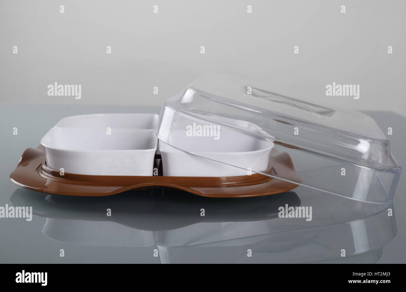 Shallow plastic bowl with lid and four compartments Stock Photo - Alamy