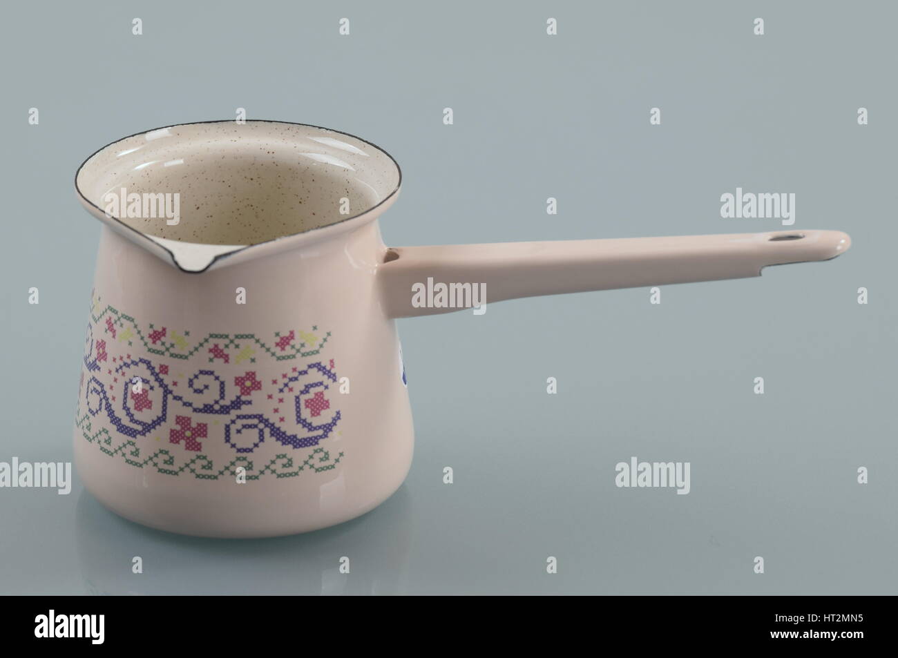 Enameled pot with handle for making turkish coffee Stock Photo - Alamy