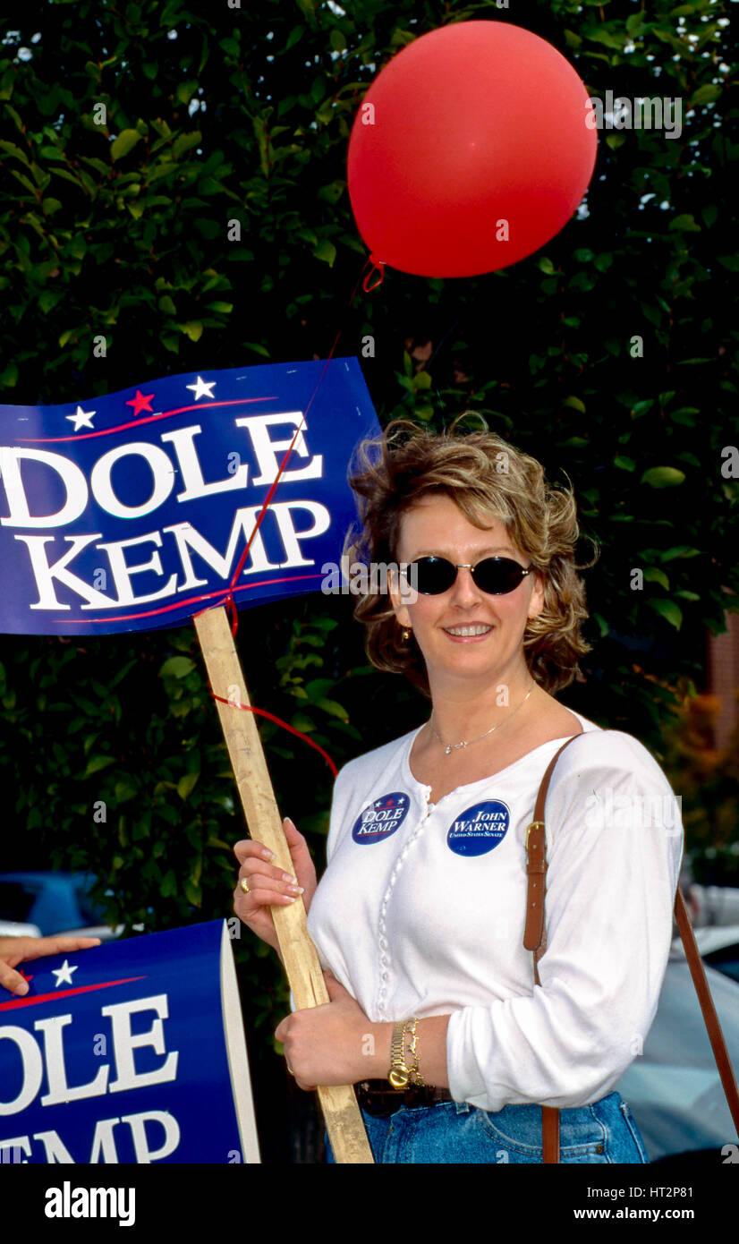 Supporters of Bob Dole line the sidewalk across the street from ...