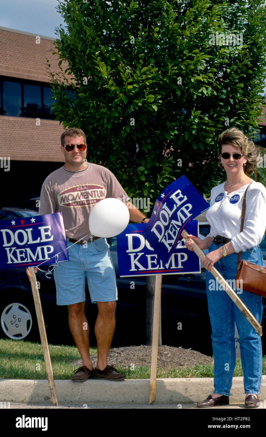 Supporters of Bob Dole line the sidewalk across the street from ...