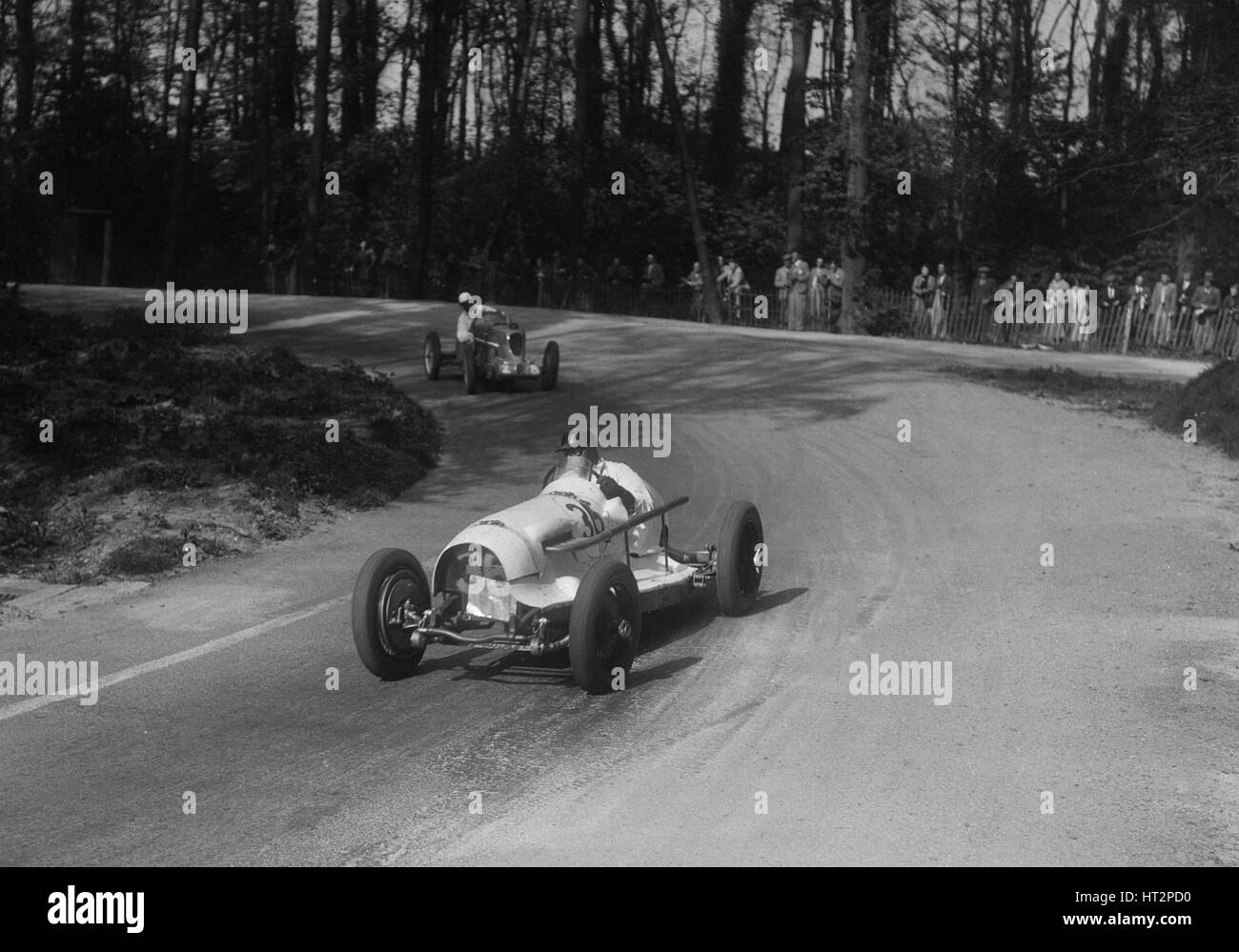 Riley of Hector Dobbs leading the MG Q type of Kenneth Evans, Donington ...