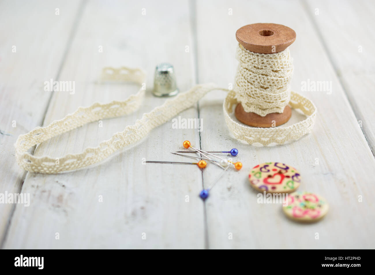 sewing tools on wooden background Stock Photo - Alamy