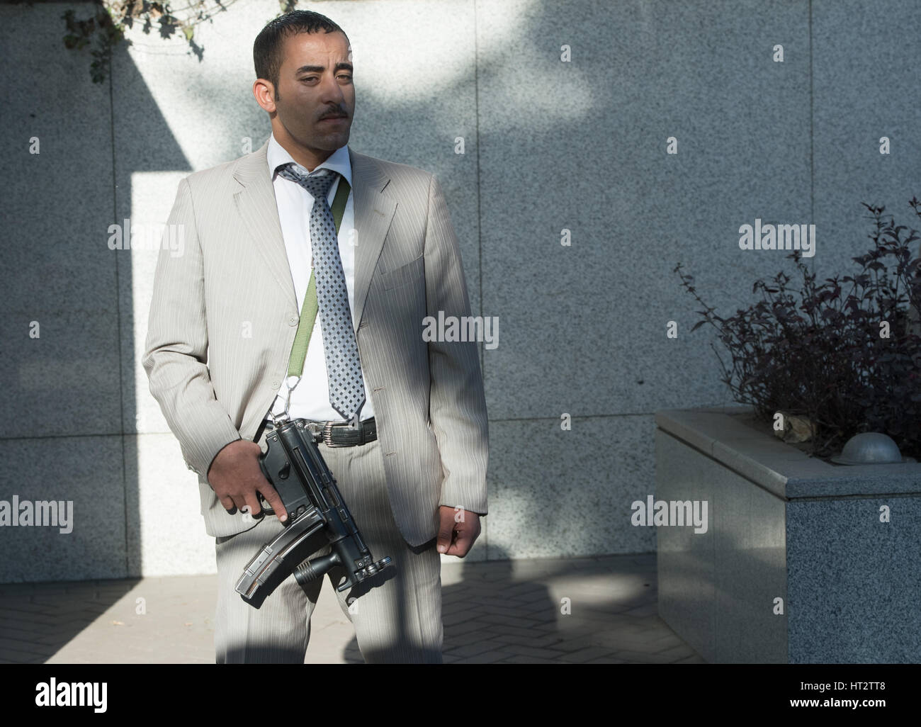 Cairo, Egypt. 03rd Mar, 2017. A bodyguard with a submachine gun watches ...