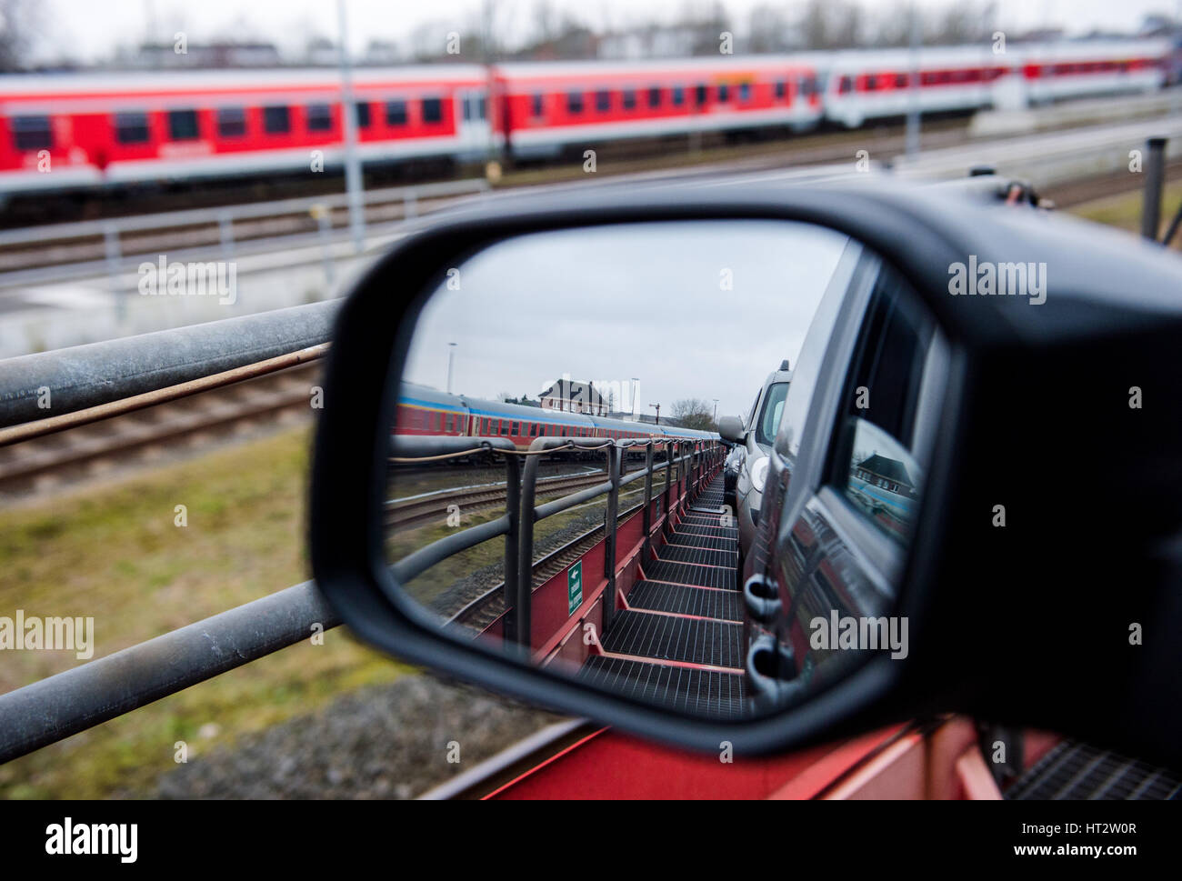Sylt, Germany. 17th Feb, 2017. A regional train and a car-carrying ...