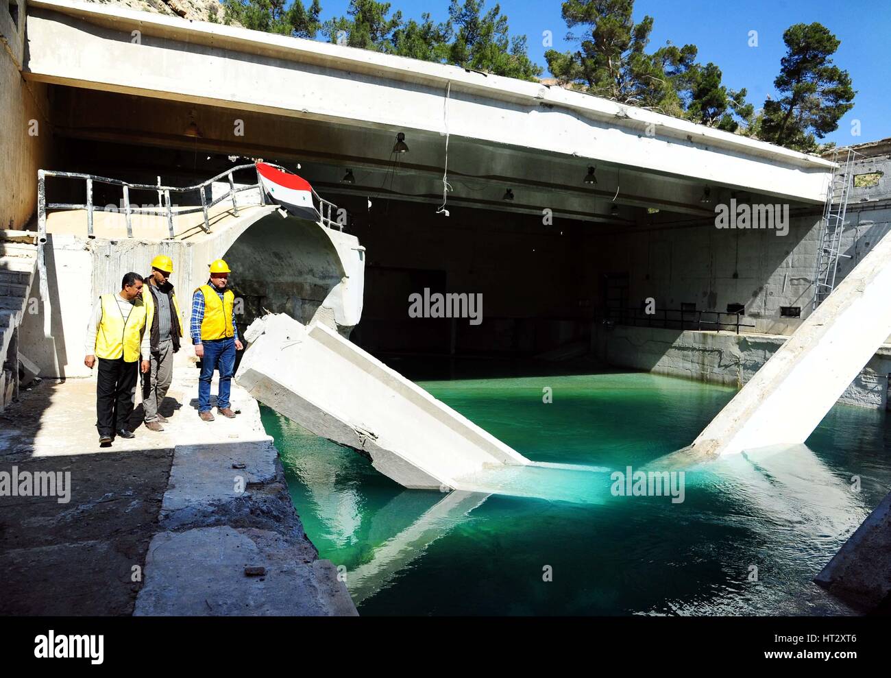 Damascus, Syria. 6th Mar, 2017. Syrian maintenance workers observe the ...