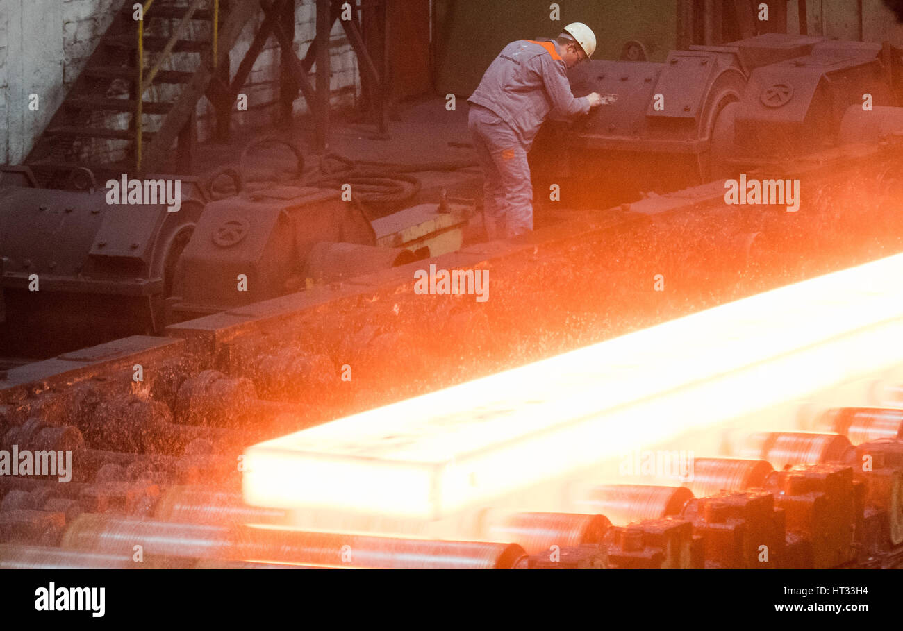 A steel slab is lumbered on the grounds of the Salzgitter AG in ...