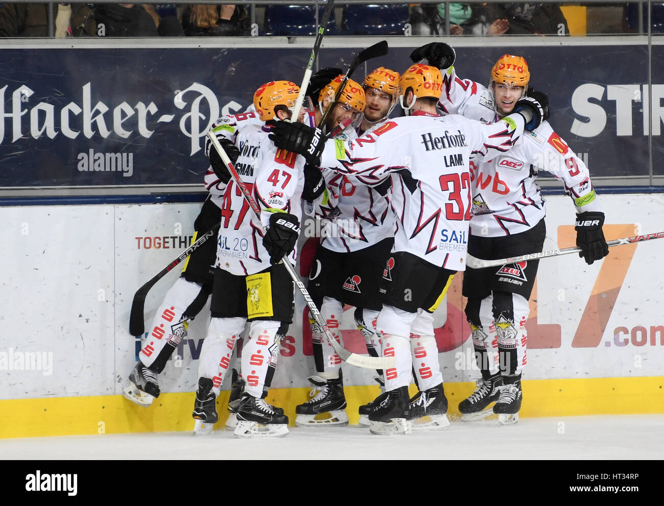 Munich, Germany. 7th Mar, 2017. Bremerhaven's team celebrates the 1:0 ...