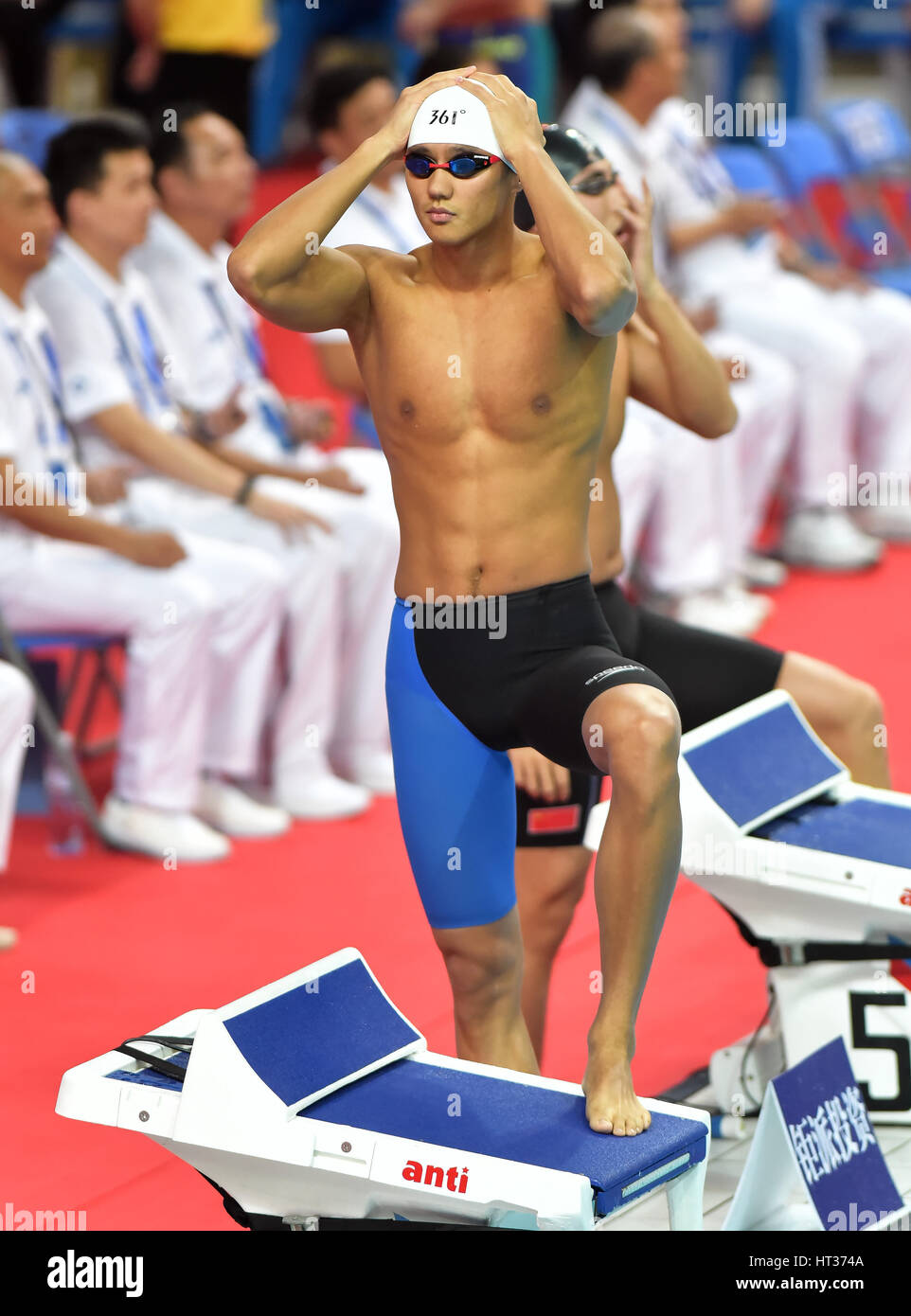 China. 7th Mar, 2017. Chinese swimmer Ning Zetao does warm-up exercises ...