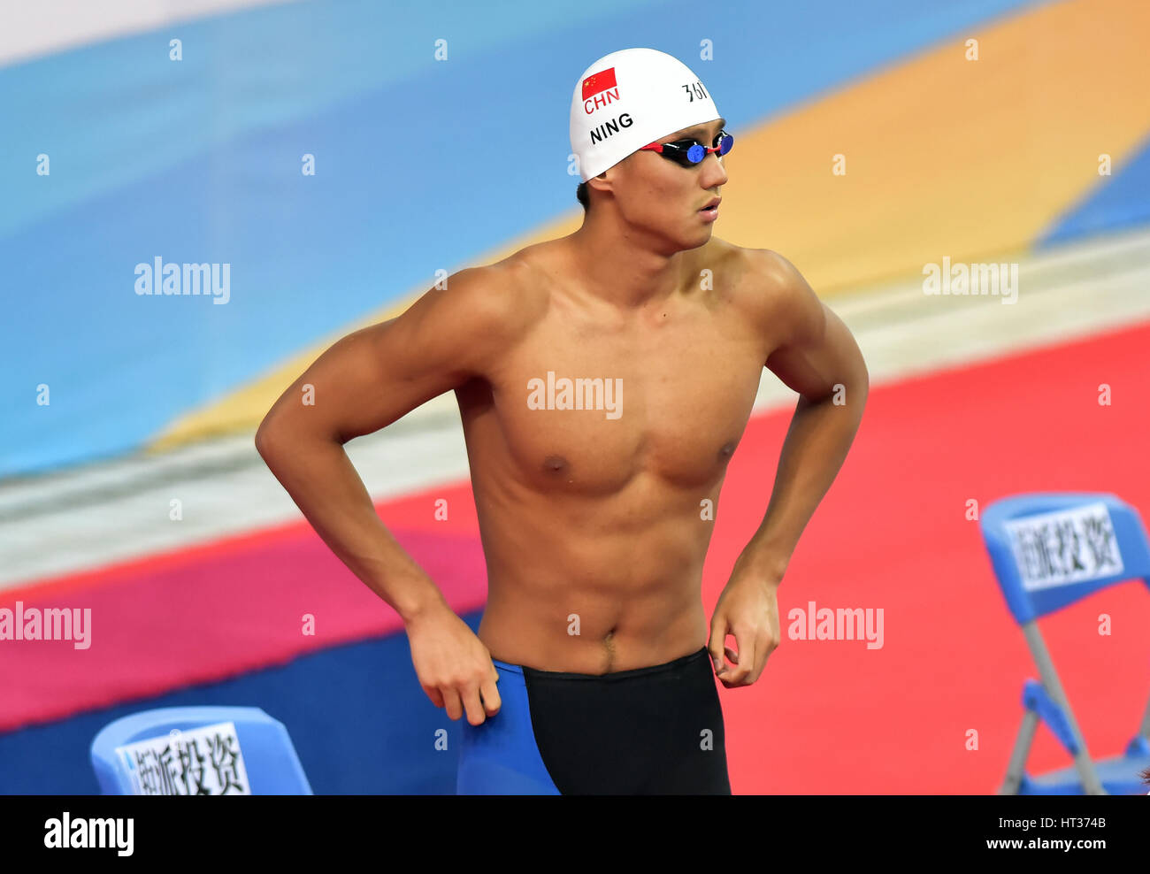 China. 7th Mar, 2017. Chinese swimmer Ning Zetao does warm-up exercises ...