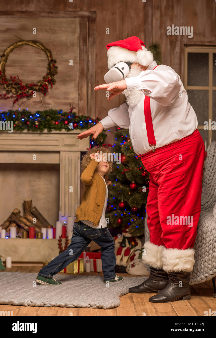 Santa Claus using virtual reality headset Stock Photo - Alamy