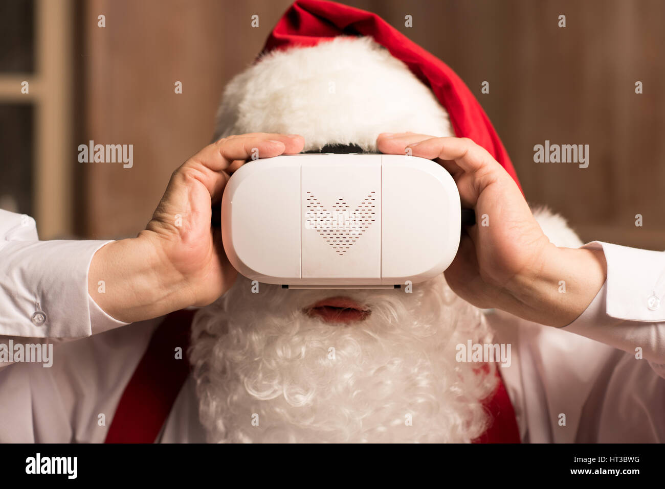 Santa Claus wearing virtual reality headset Stock Photo - Alamy