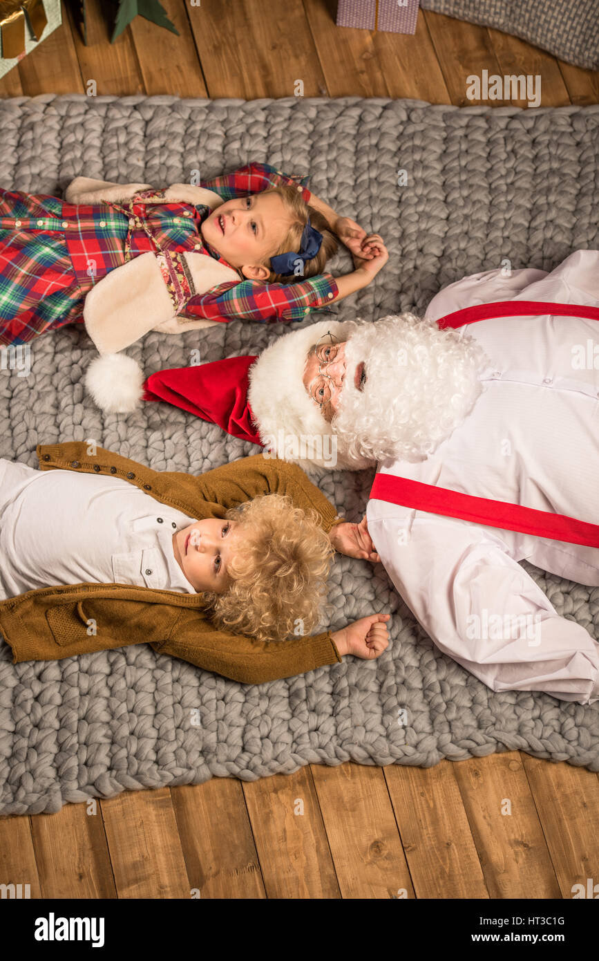 Happy Santa Claus with children Stock Photo - Alamy