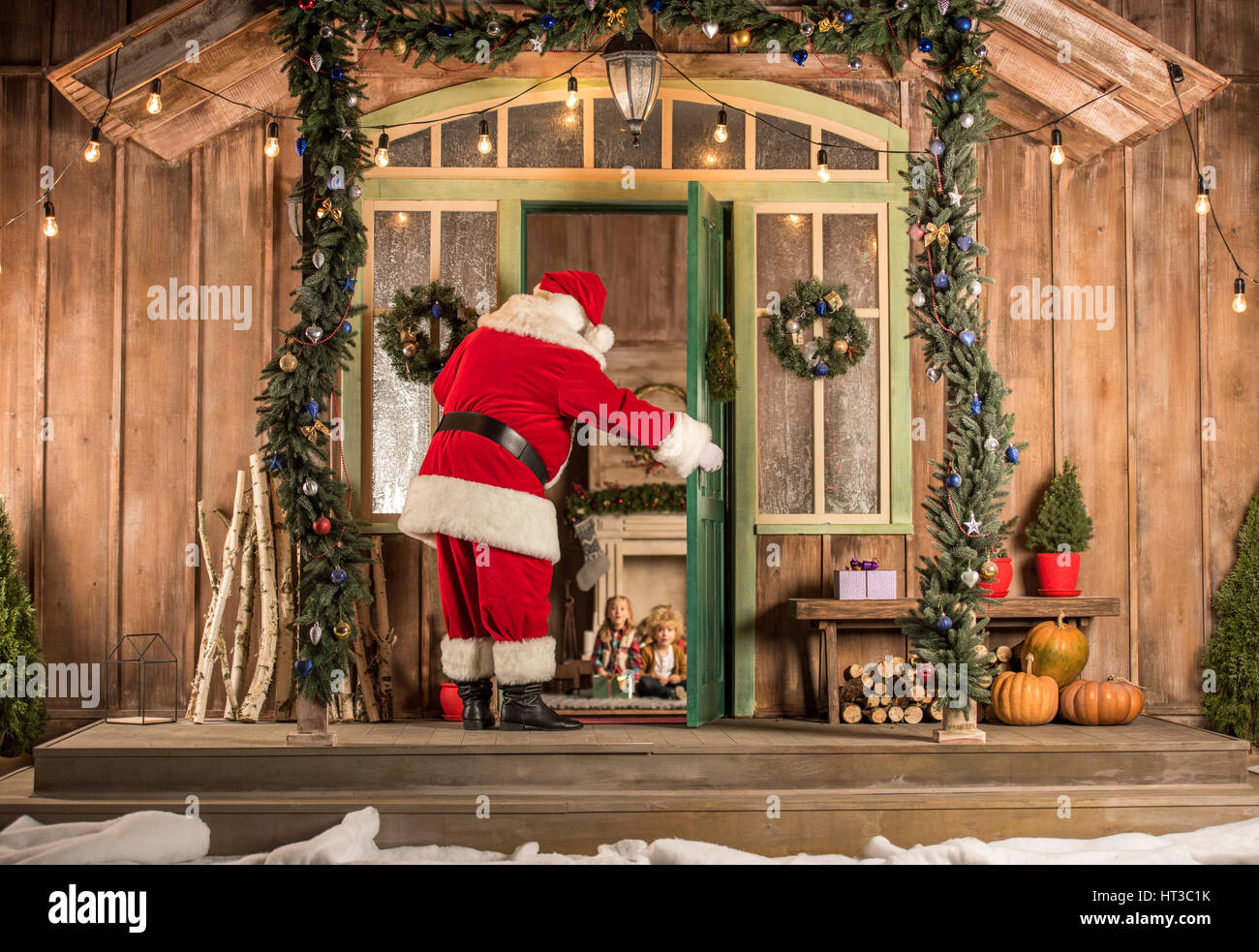 Santa Claus coming to children at Christmas Stock Photo - Alamy