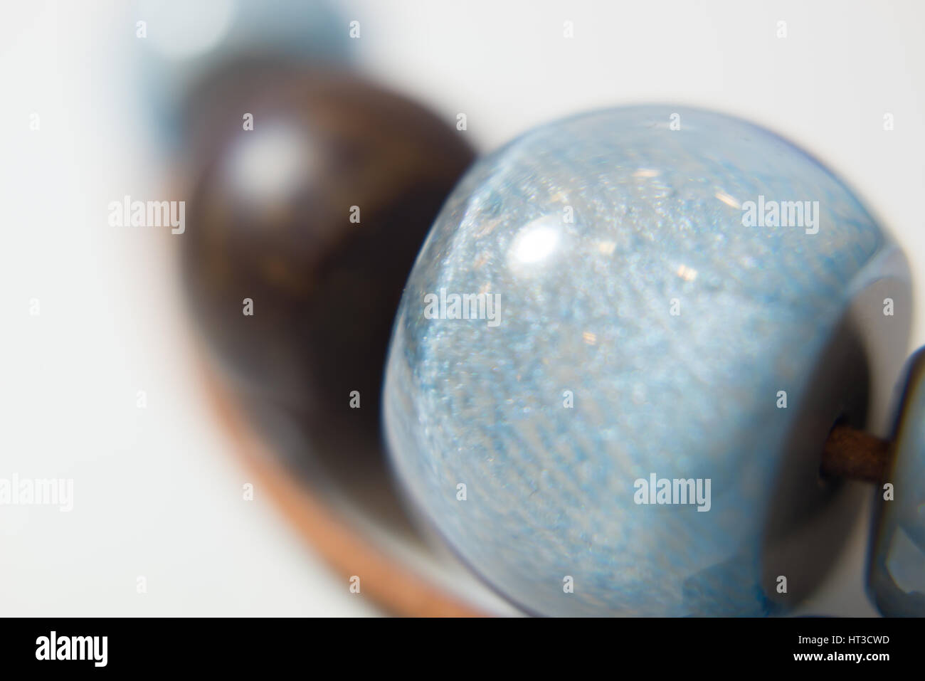 Necklace of red plastic on a white background ethnic Stock Photo - Alamy